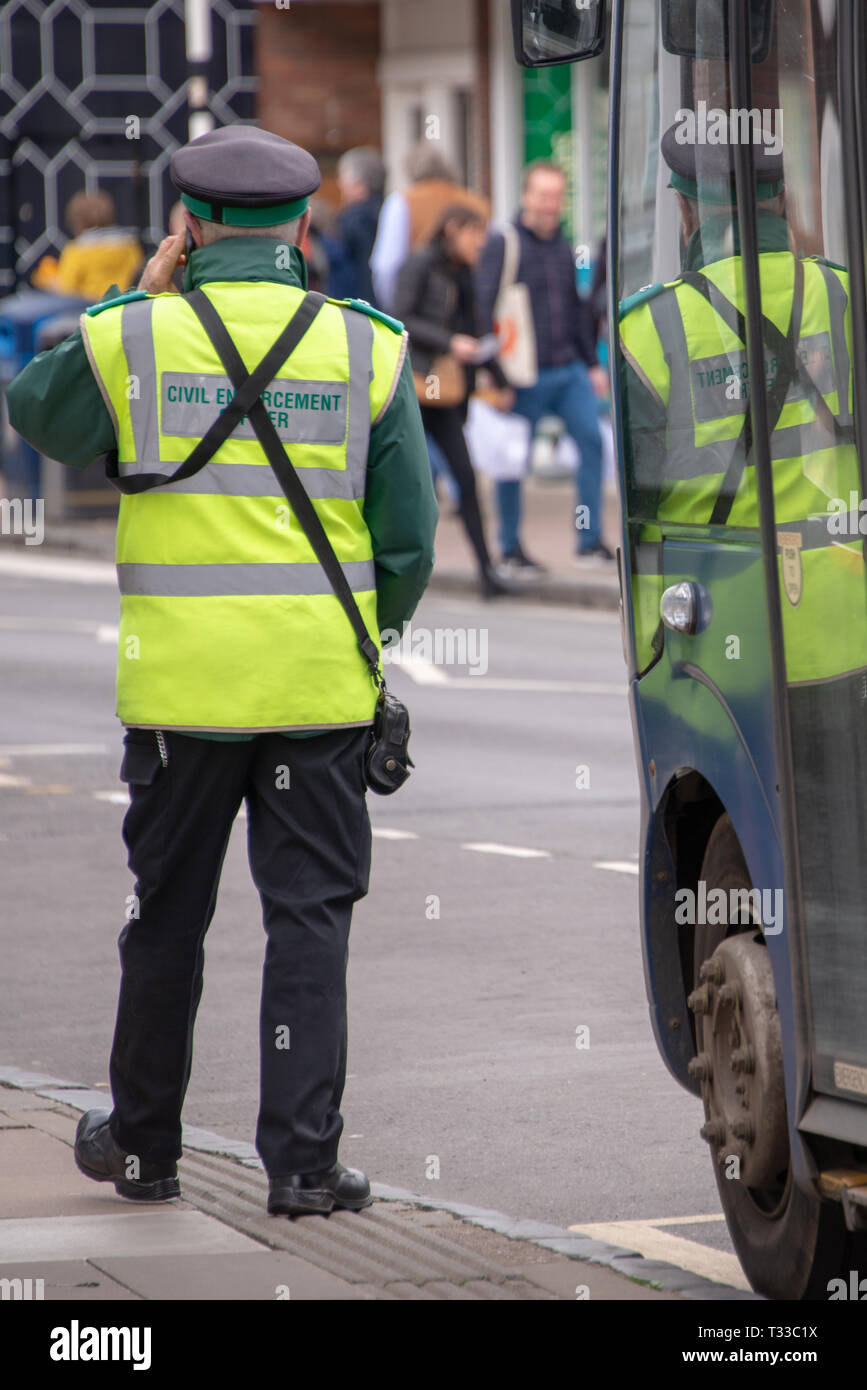 traffic warden otherwise known as civil enforcement officer talks on ...
