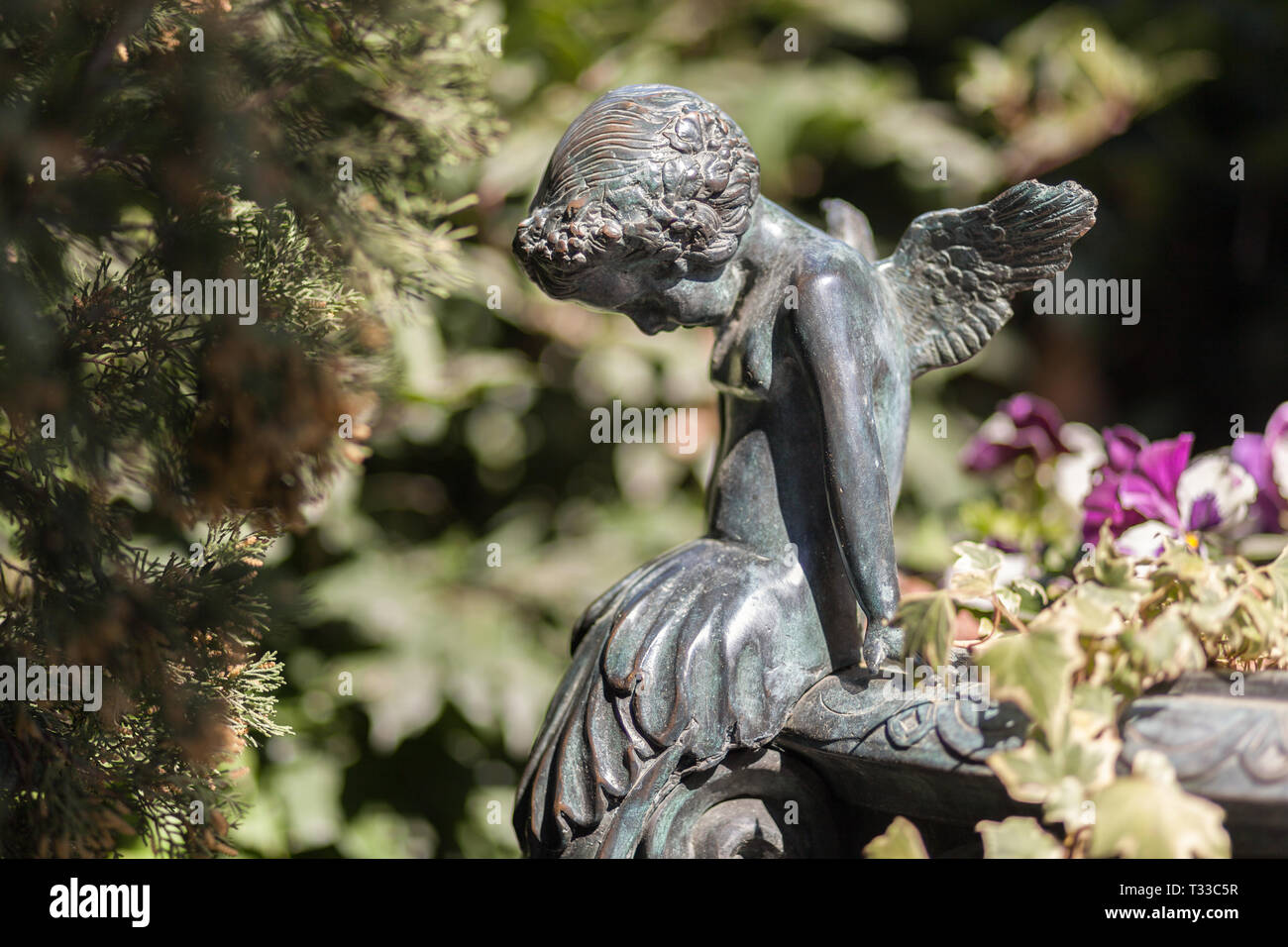 Statue in natural park backgorund, fresh green spring bacground or ...