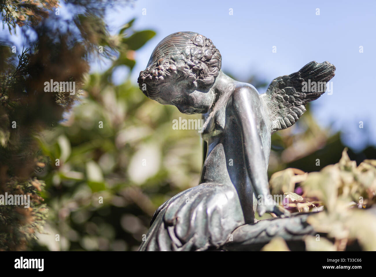 Statue in natural park backgorund, fresh green spring bacground or ...