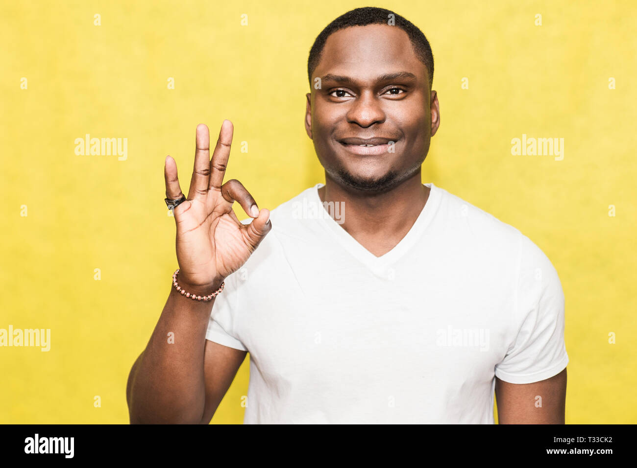 Handsome African American man shows ok sign. Body language concept ...