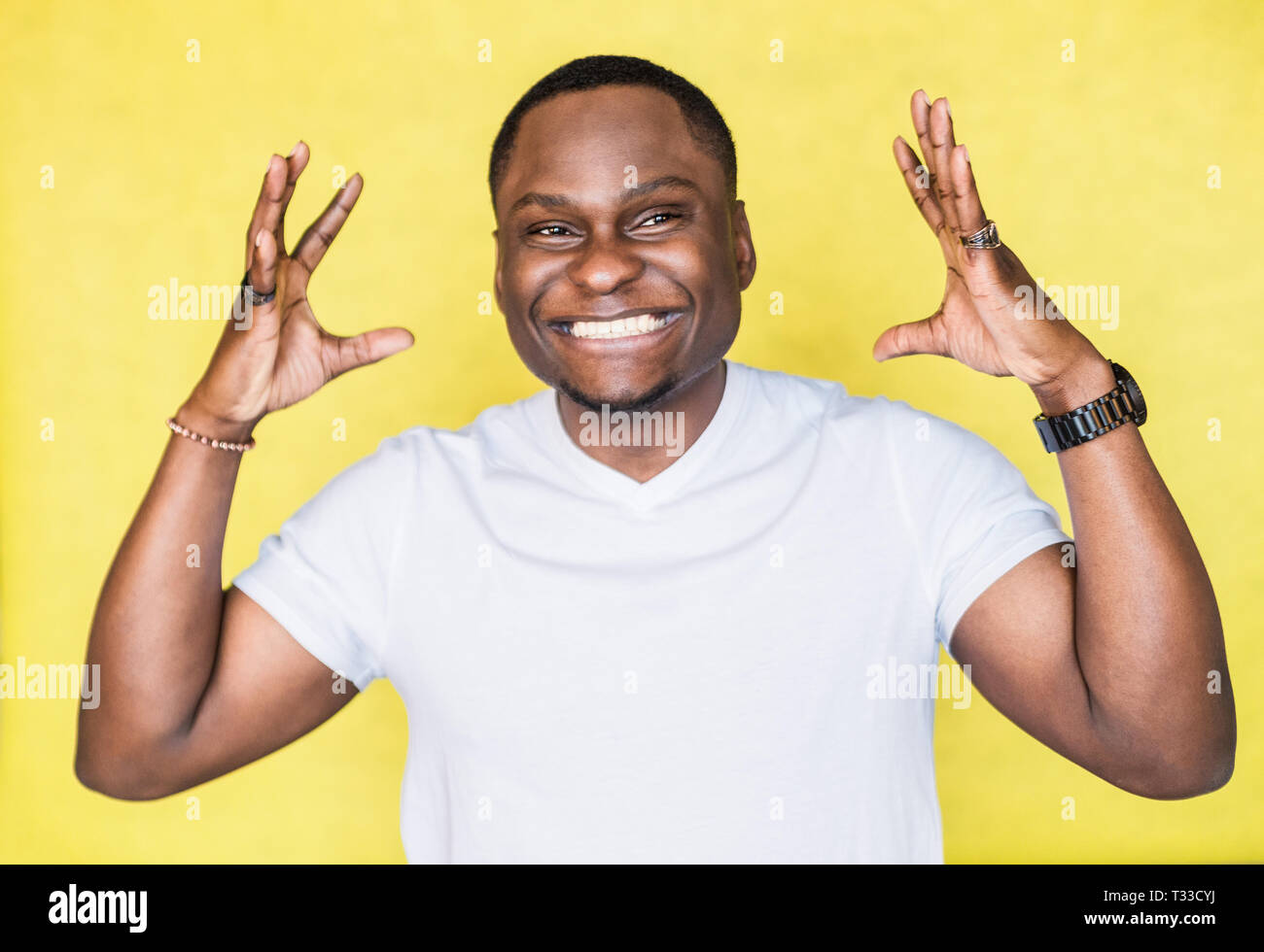 Handsome African American Man Showing Something Big Gesture By Hands