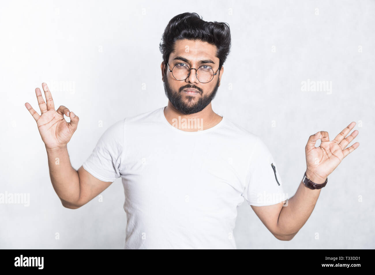 Handsome young man shows ok sign. Body language concept Stock Photo - Alamy
