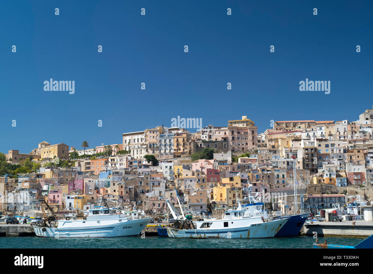 Fishing trawlers in Sciacca Port with the town behind, south coast of ...
