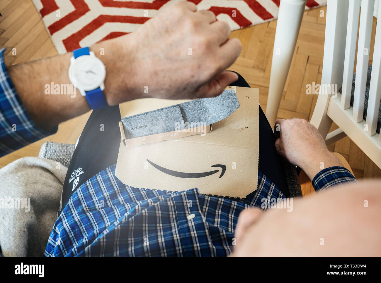 Paris, France - Mar 29, 2019: Senior man unboxing unpacking latest ...