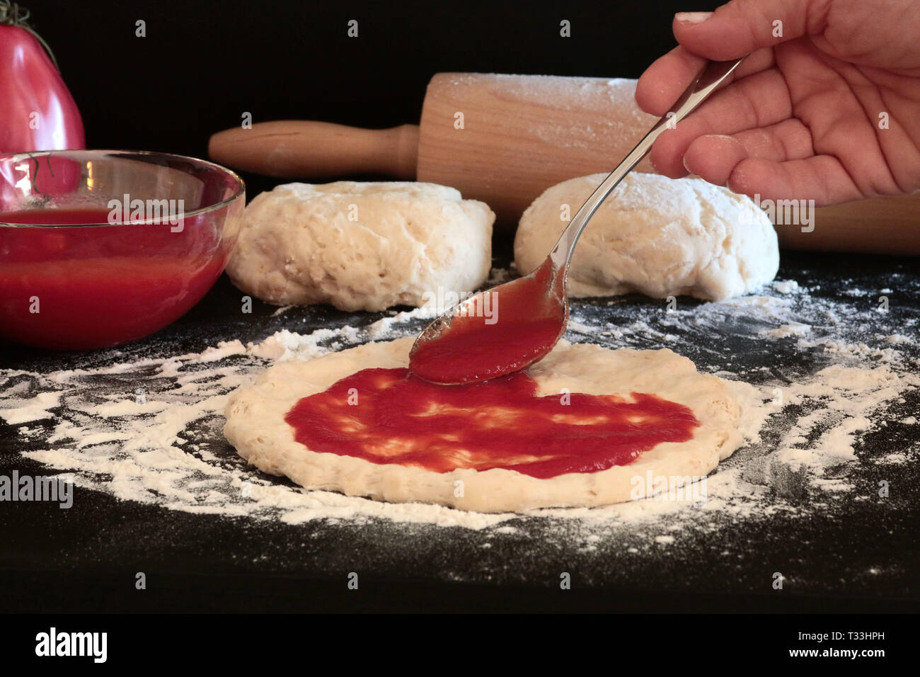 Homemade pizza. Ingredients for making italian pizza on dark background ...