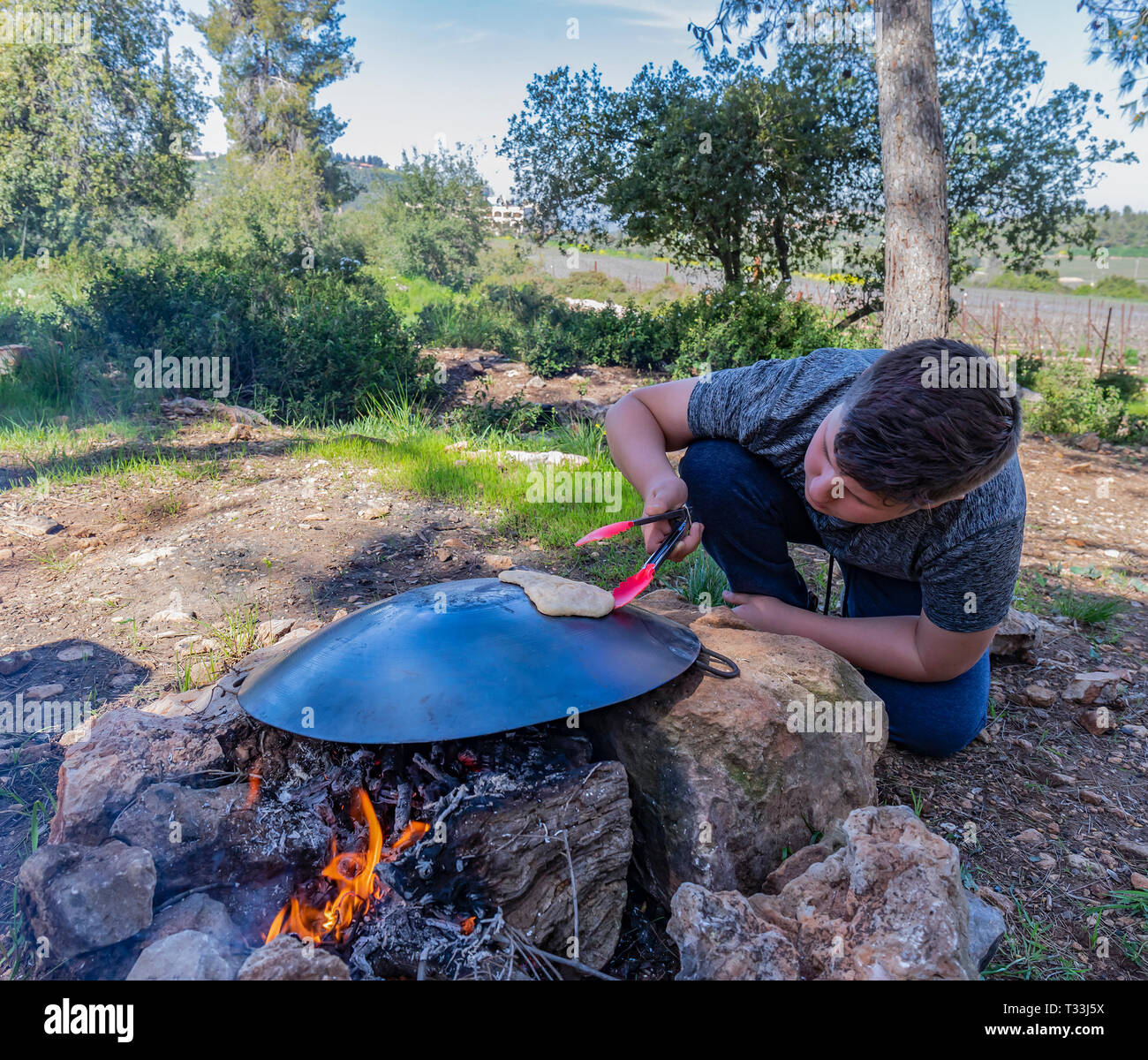 Boy at a campfire hi-res stock photography and images - Alamy