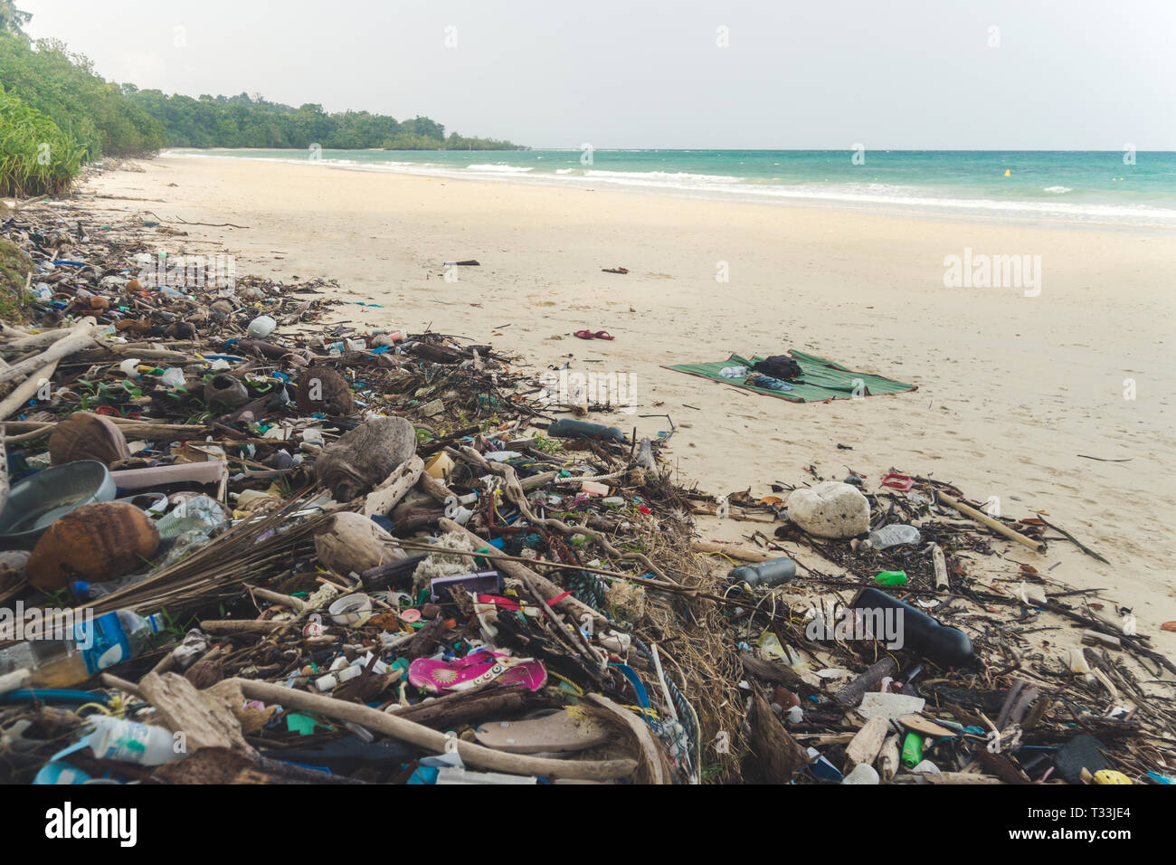 Beach pollution. Plastic bottles and other trash on sea beach. garbage ...