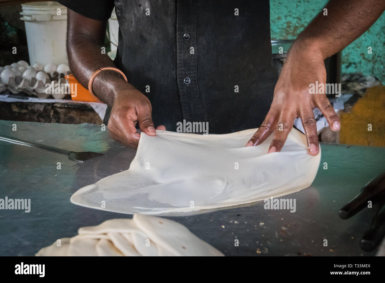 Making of Roti Canai, Roti cooking process, roti fried indian food ...