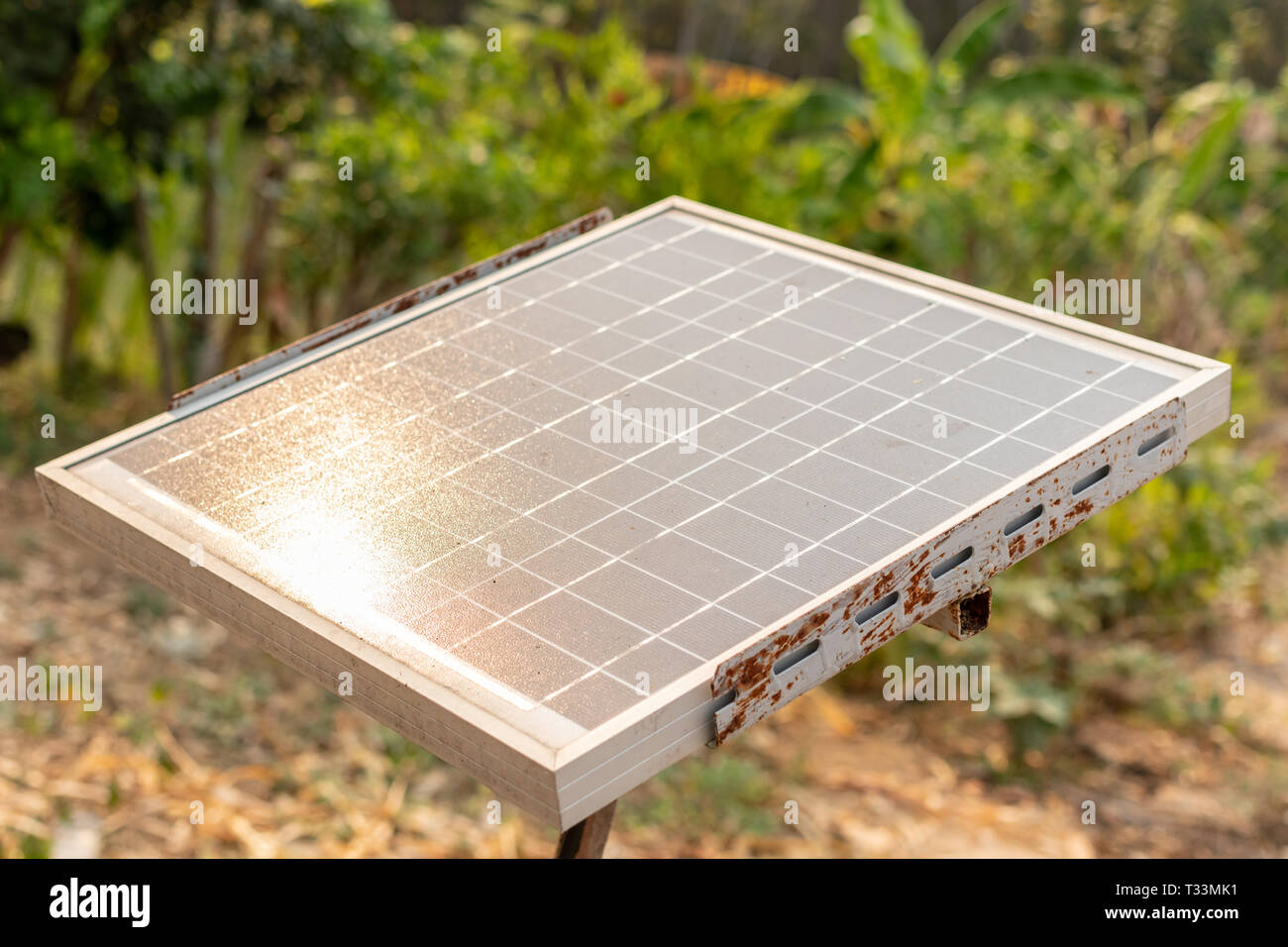 Small size solar cells panels in a garden Stock Photo - Alamy