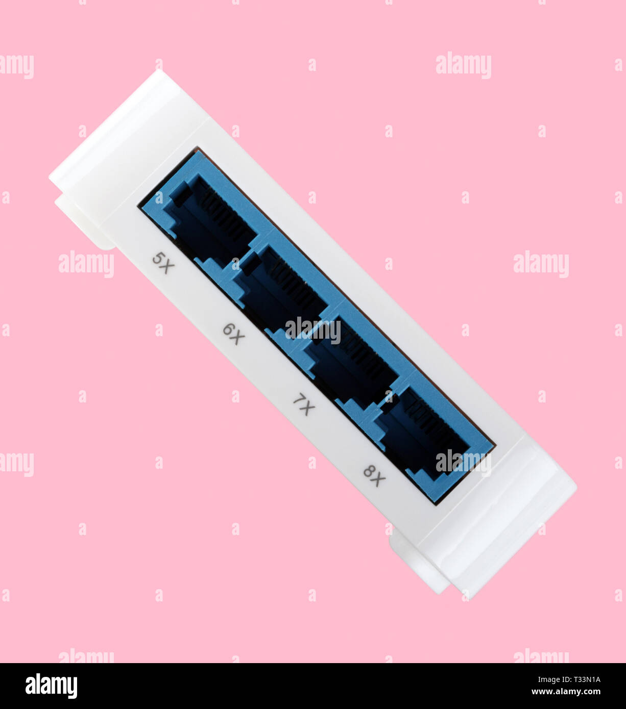 White 8 Port Plastic Ethernet Switch isolated on pink background at dry ...