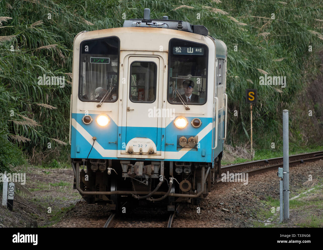 A Japan Rail Shikoku one man Yosan Line train approaching Shimonada ...