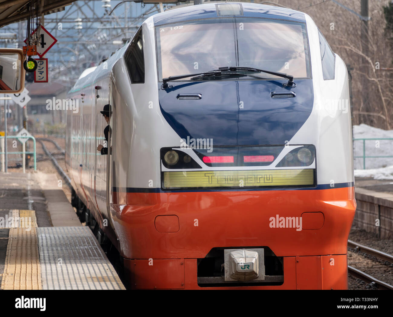 A Japan Rail East Tsugaru express train leaving Takanosu Station on the ...