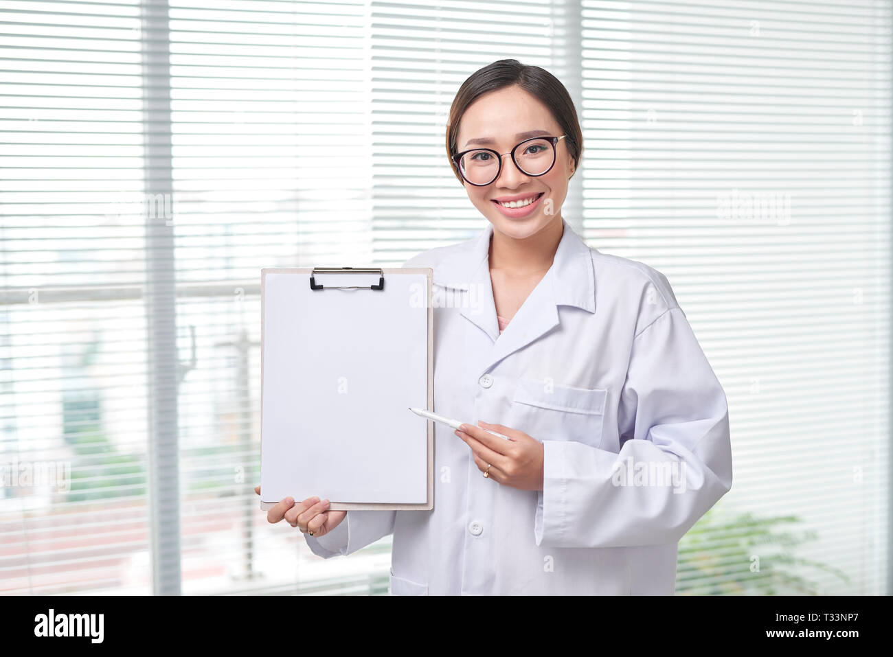 Female writing clipboard isolated hi-res stock photography and images ...