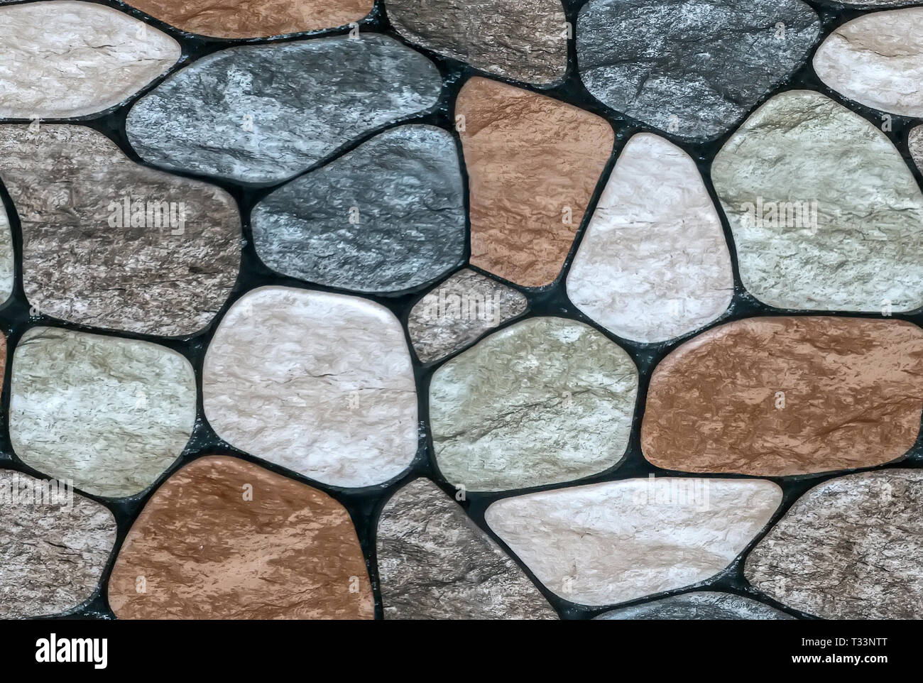multicolored stone with rounded faces wall background. Seamless ...