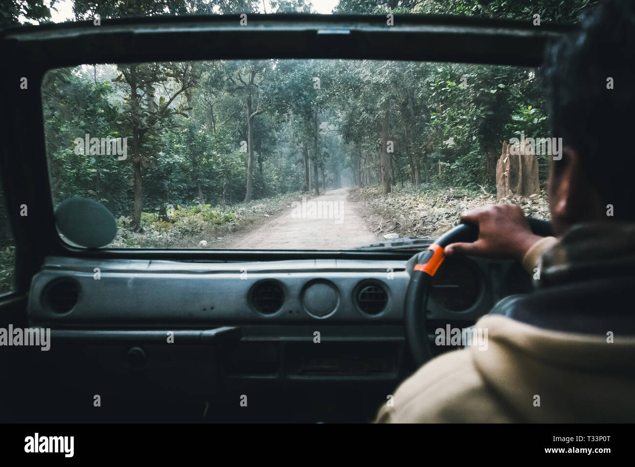 Behind the wheel of a classic retro car. The view from the back ...
