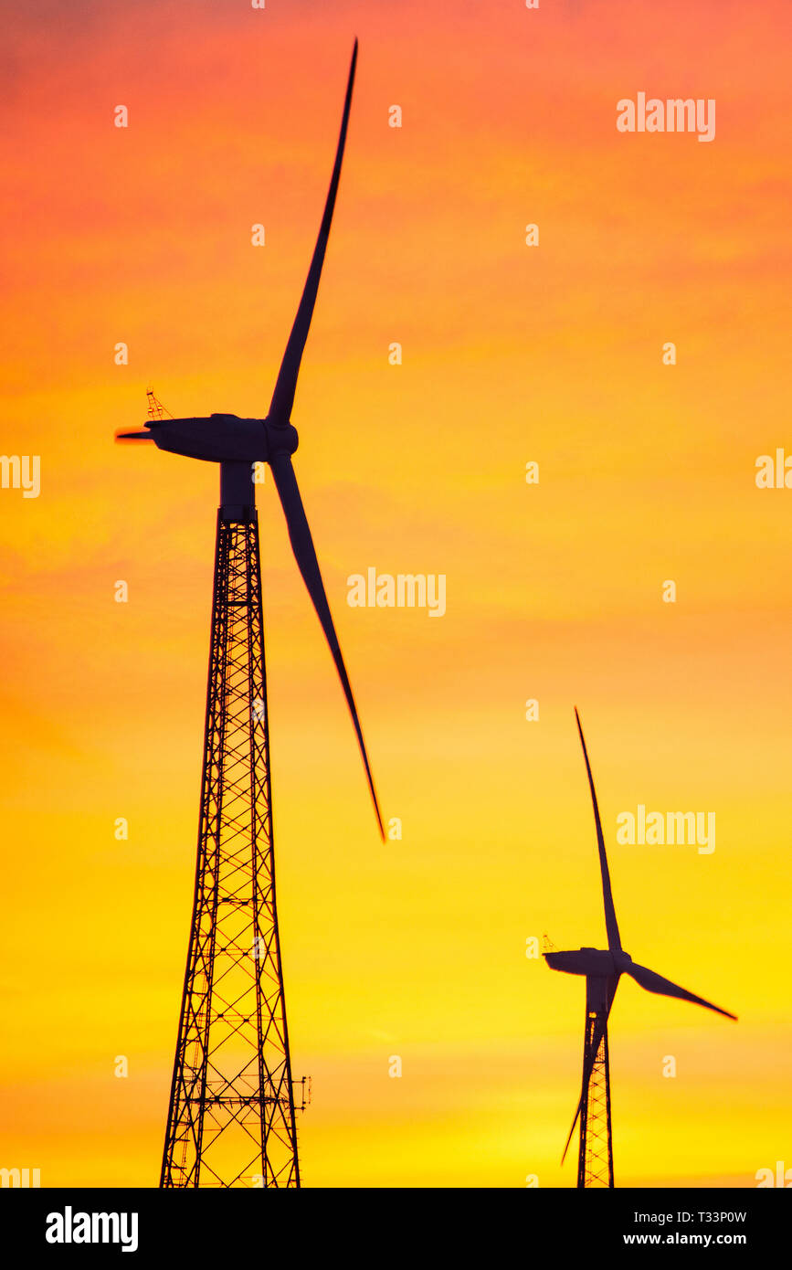 A wind turbine during a beautiful sunset Stock Photo - Alamy
