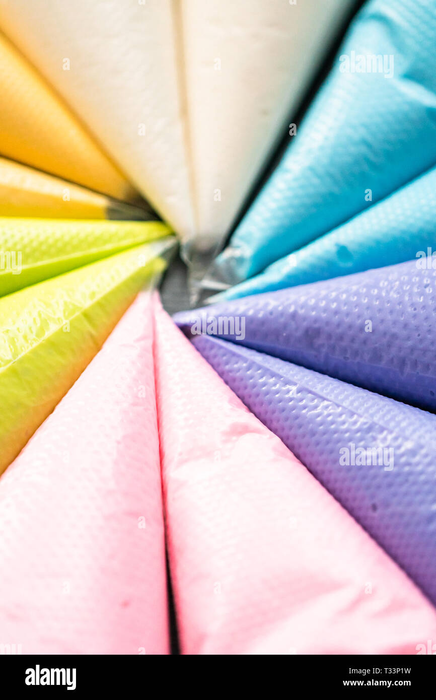 Variety of colors of royal icing in plastic piping bags Stock Photo - Alamy
