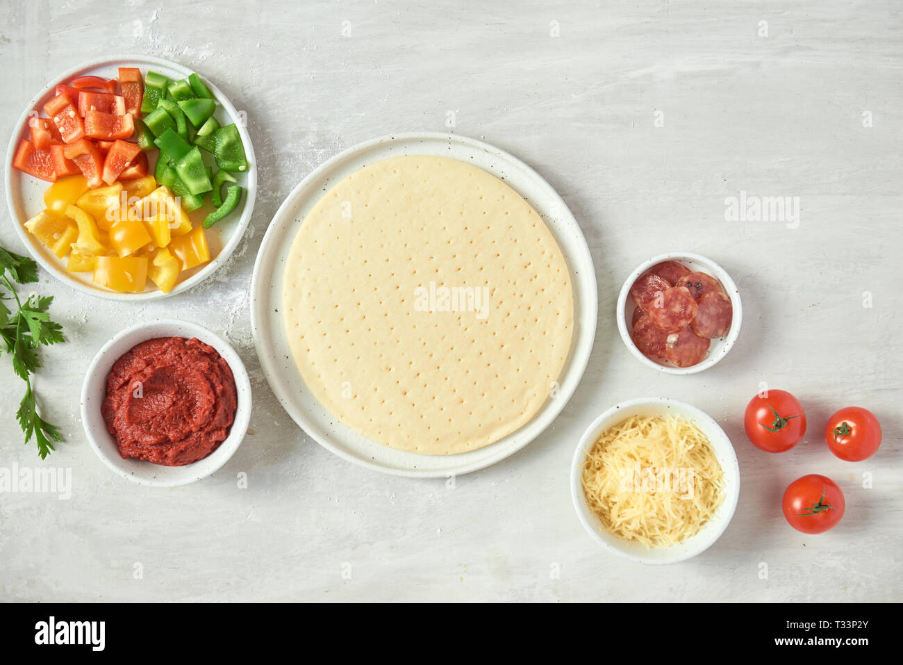 Preparing individual pizzas from pizza bar Stock Photo - Alamy