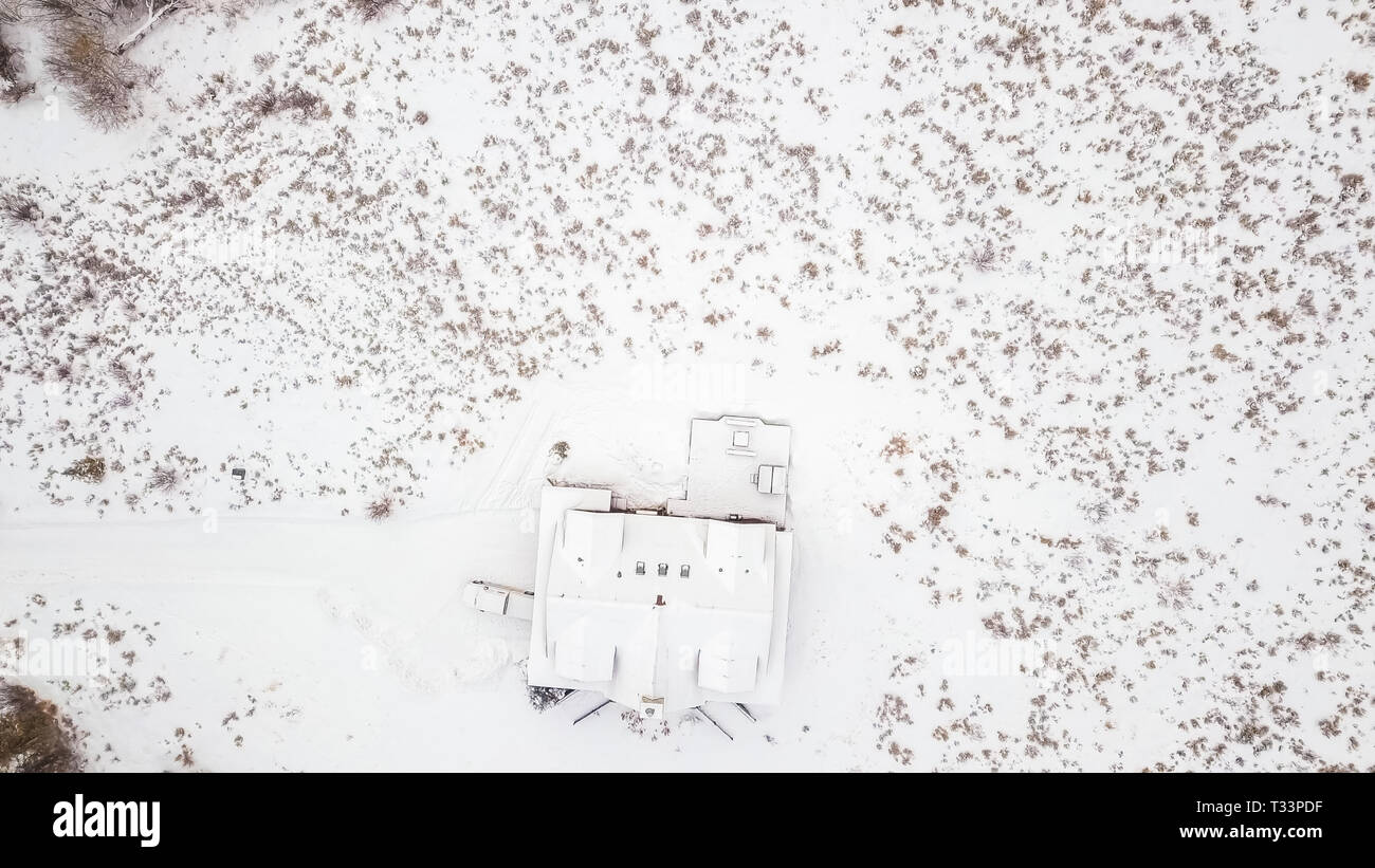 Aerial view of the mountain house covered in snow in the Winter Stock ...