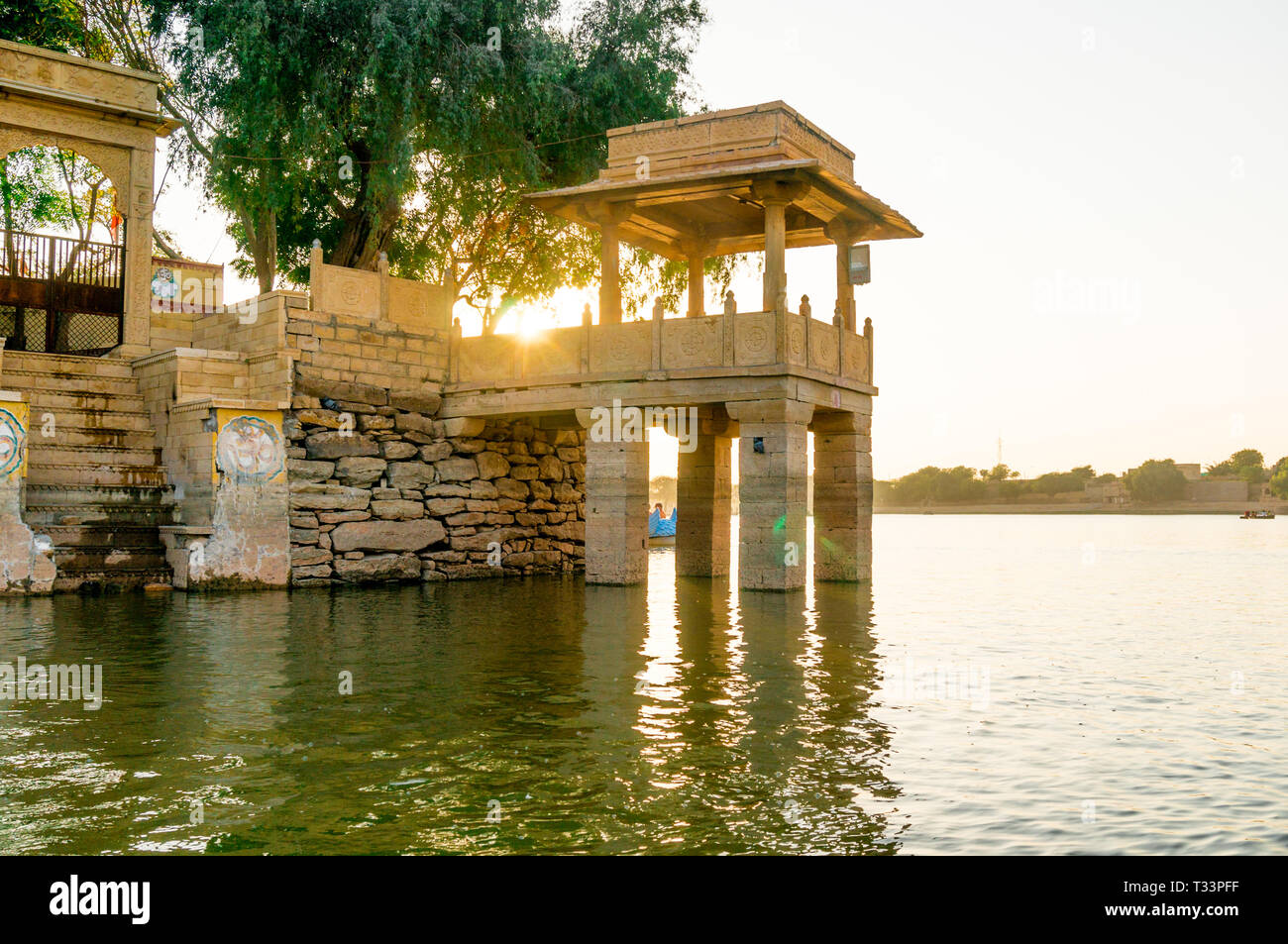 Central island park with sandstone buildings and trees growing at gadi ...