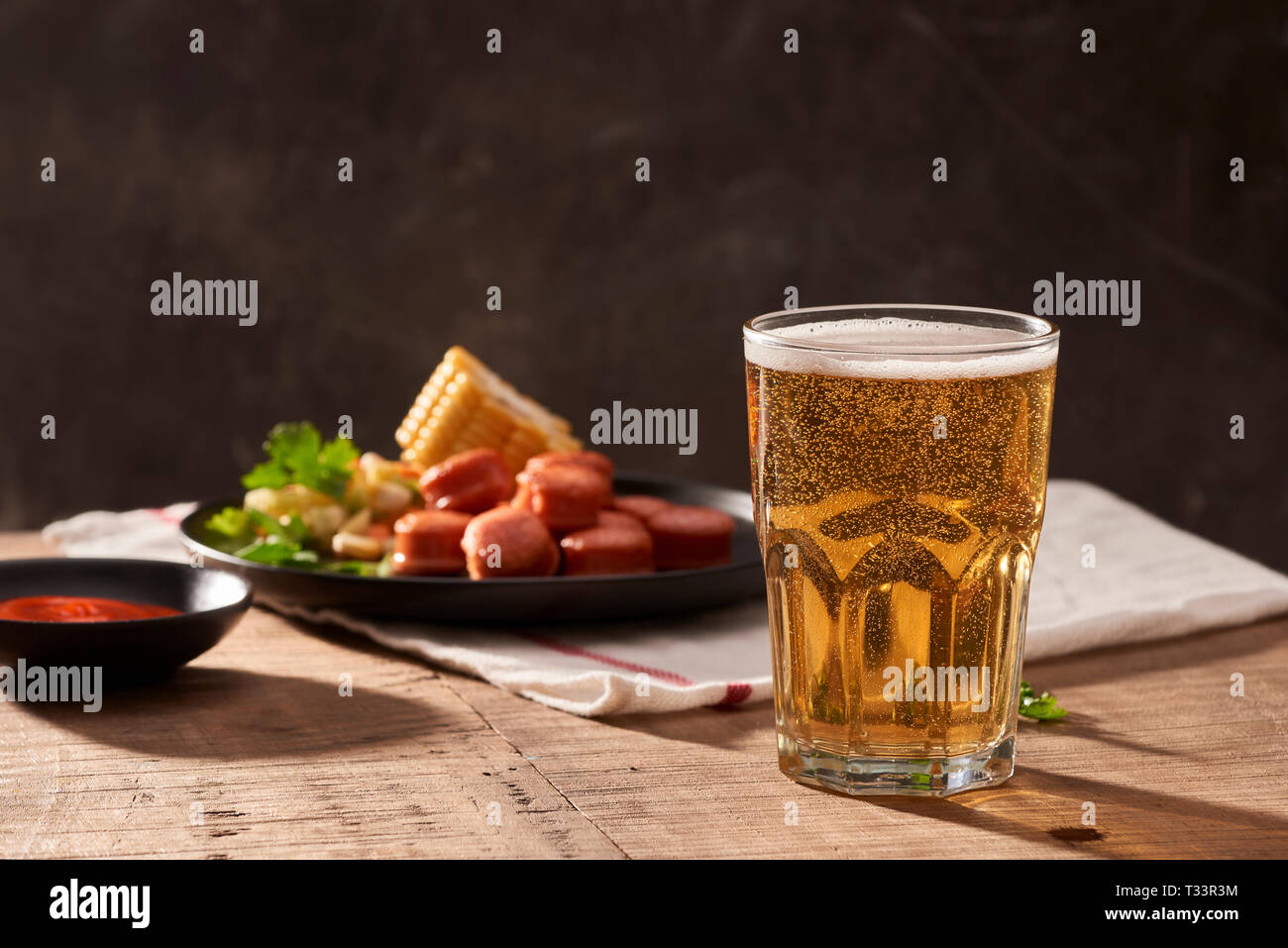 Beer and appetizing beer snacks set. Table with mug beer grilled ...