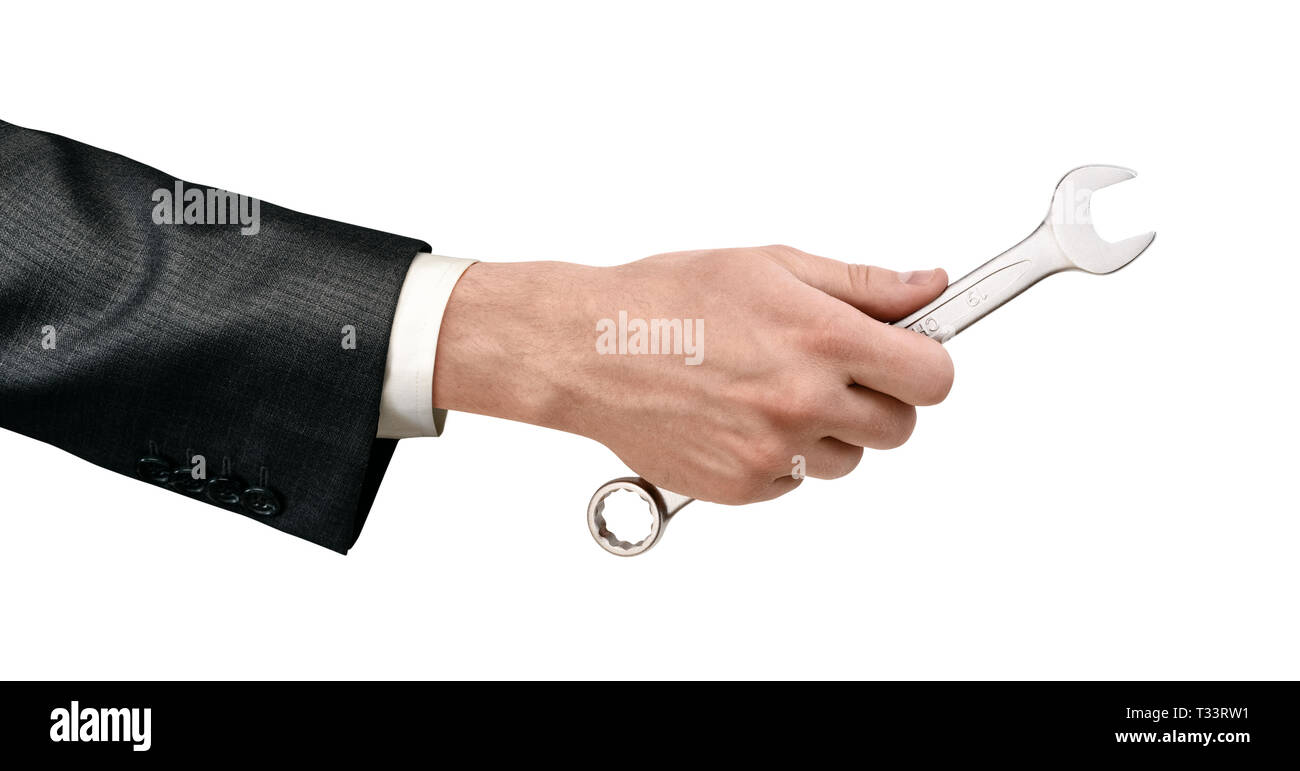 Male hand holding a silver spanner isolated on white background Stock ...