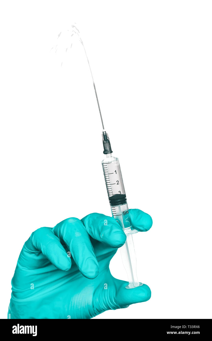 Medical syringe in the doctor's hand. Gloved hand. Isolated on white ...