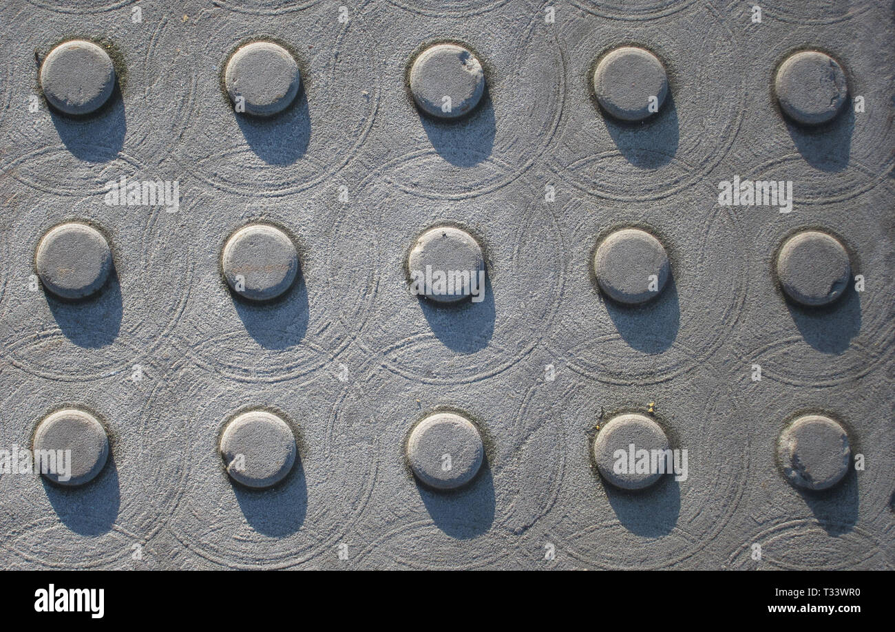Concrete slab with raised bumps Stock Photo - Alamy
