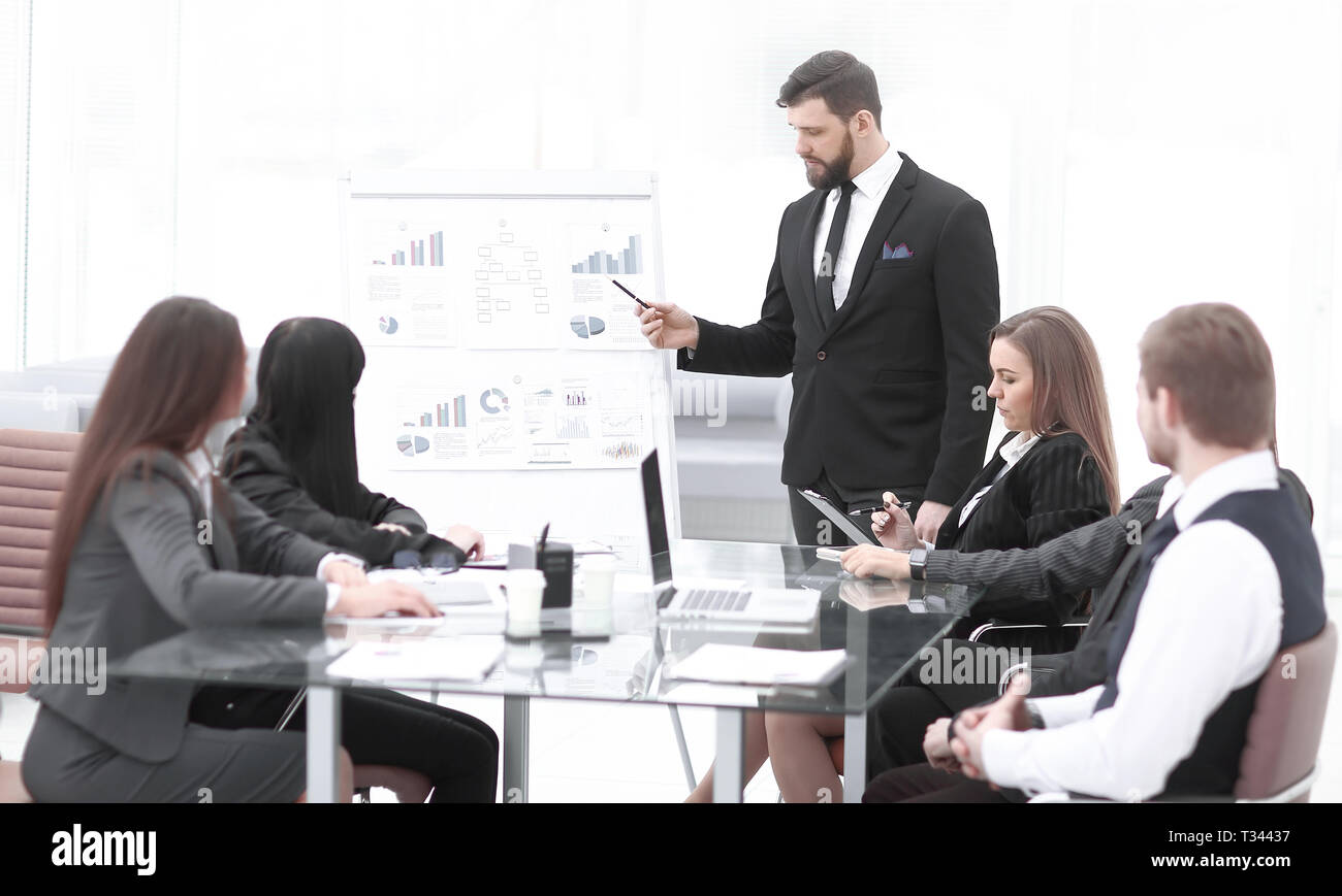 attentive business partners looking at successful entrepreneur pointing ...