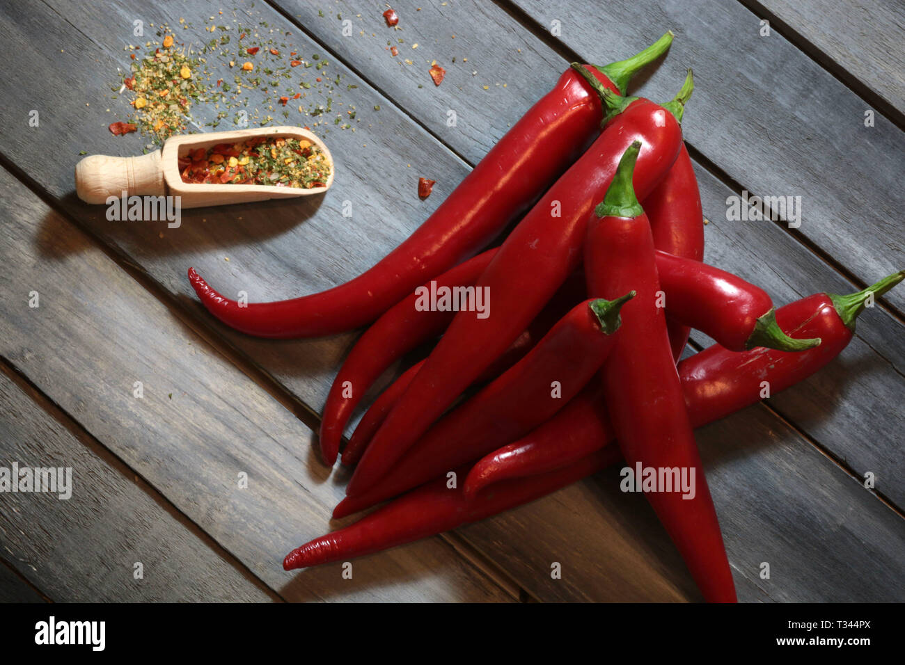 Red hot chili peppers on wooden table. Directly above Stock Photo - Alamy