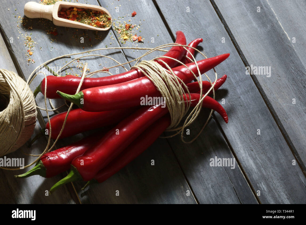 Red hot chili peppers on wooden table. Directly above Stock Photo - Alamy