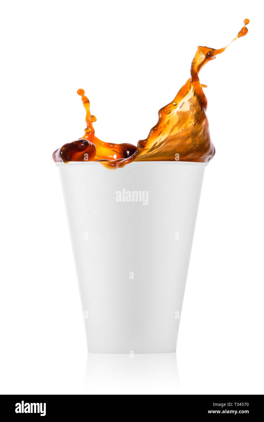 Coffee splash in a white disposable glass isolated on white background ...