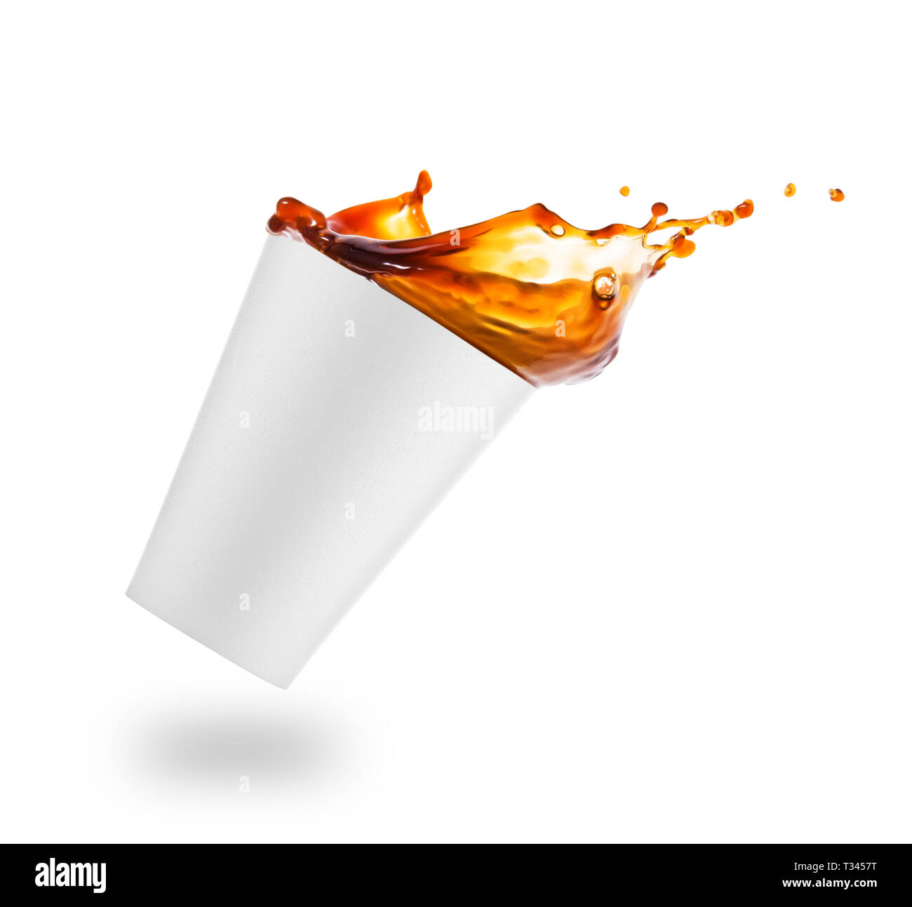 Splash of hot coffee in a white glass isolated on white background ...
