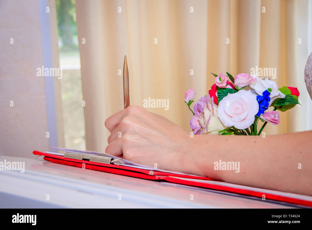 Hand signs in the registry office. Painting in the registry office ...