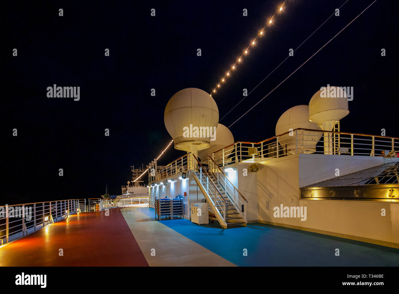 Night view of the illuminated upper deck of cruise ship Stock Photo - Alamy