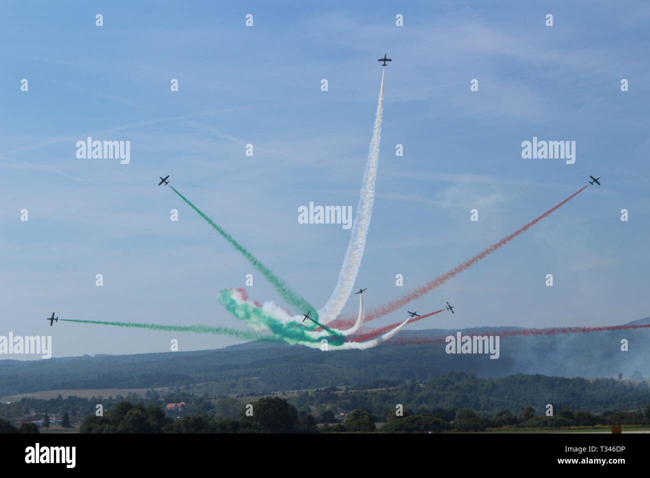 Flying Frecce Tricolori planes with colorful smoke Stock Photo - Alamy