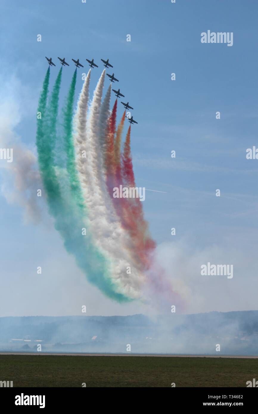 Flying Frecce Tricolori planes with colorful smoke Stock Photo - Alamy