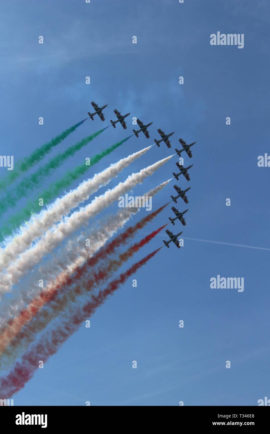 Flying Frecce Tricolori planes with colorful smoke Stock Photo - Alamy