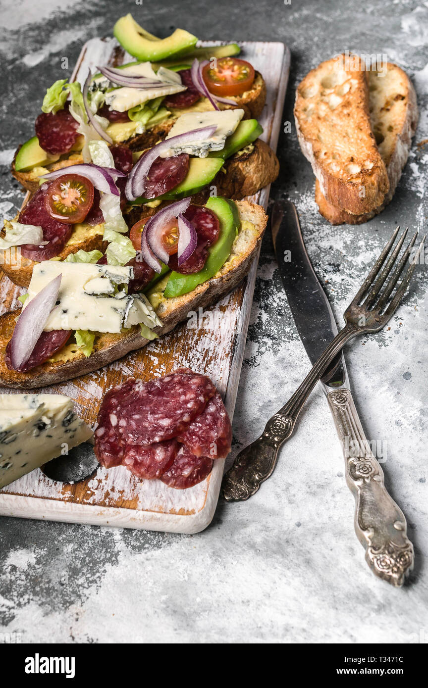 Traditional italian panini sandwiches with smoked sausage, crispy salad ...