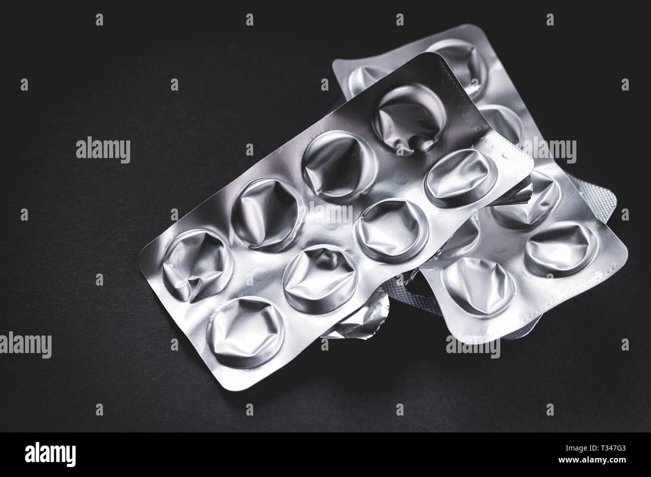 Empty blister from pills on a dark background. Used tablet blister ...