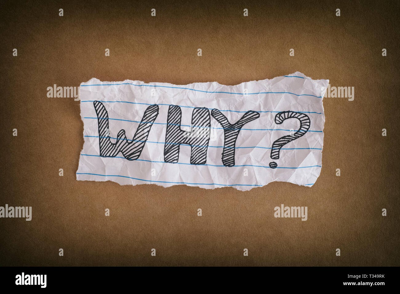 Why? Why question on brown paper background. Close up Stock Photo - Alamy