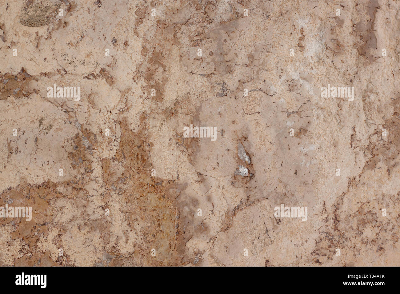 Brown structure with fractures and gray spots. Classic travertine ...