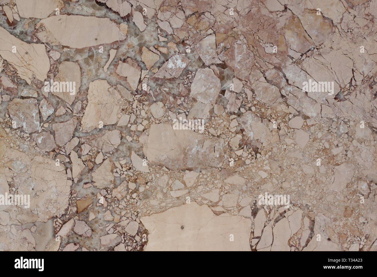 Classic travertine texture. Brown structure with fractures and spots ...