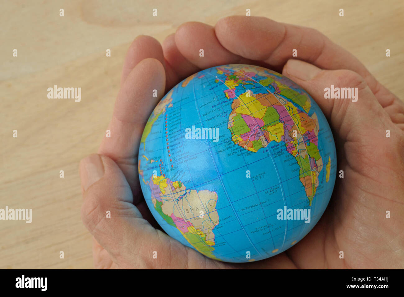 Woman hands holding the World - Concept of protecting and saving the ...