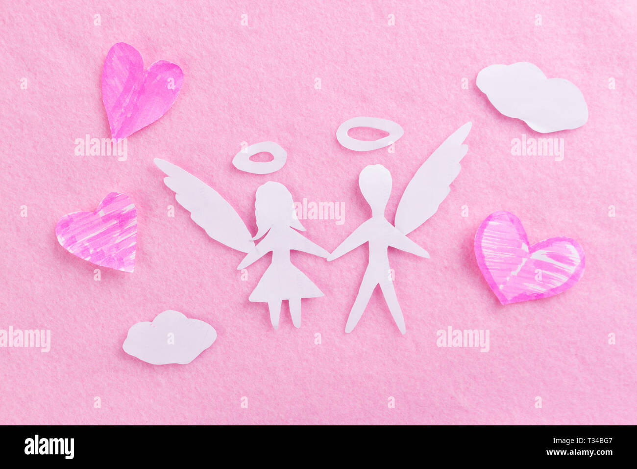 two cartoon angels. boy and girl. paper cut Stock Photo - Alamy