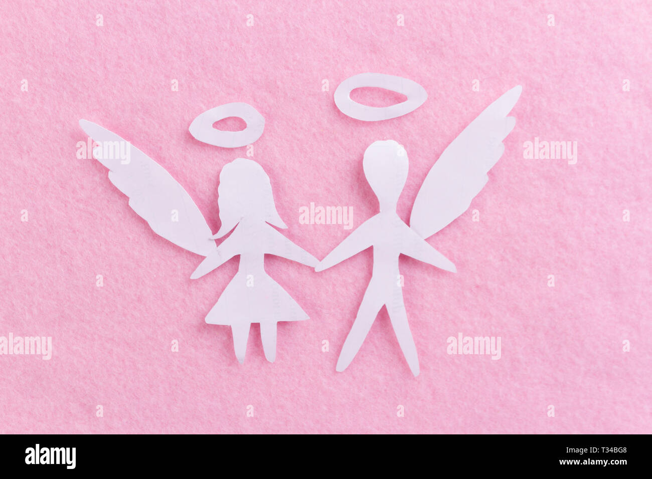 two cartoon angels. boy and girl. paper cut Stock Photo - Alamy