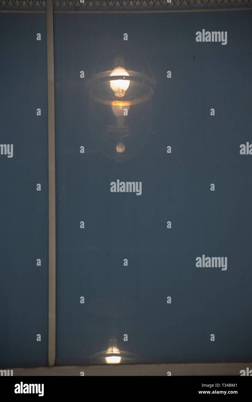 Lamp reflection through the window Stock Photo - Alamy