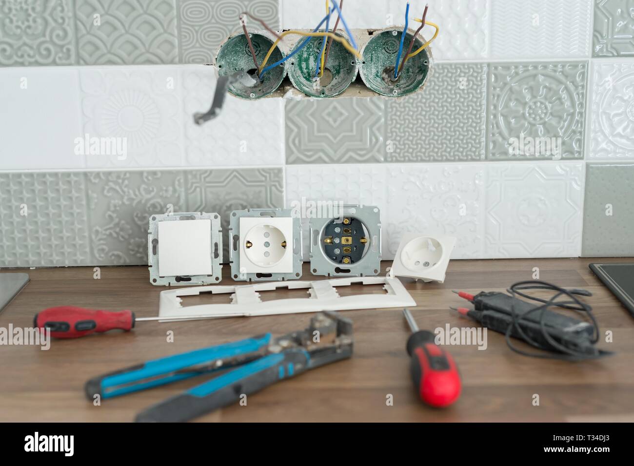 Preparing to install an electrical outlet. Closeup of professional ...