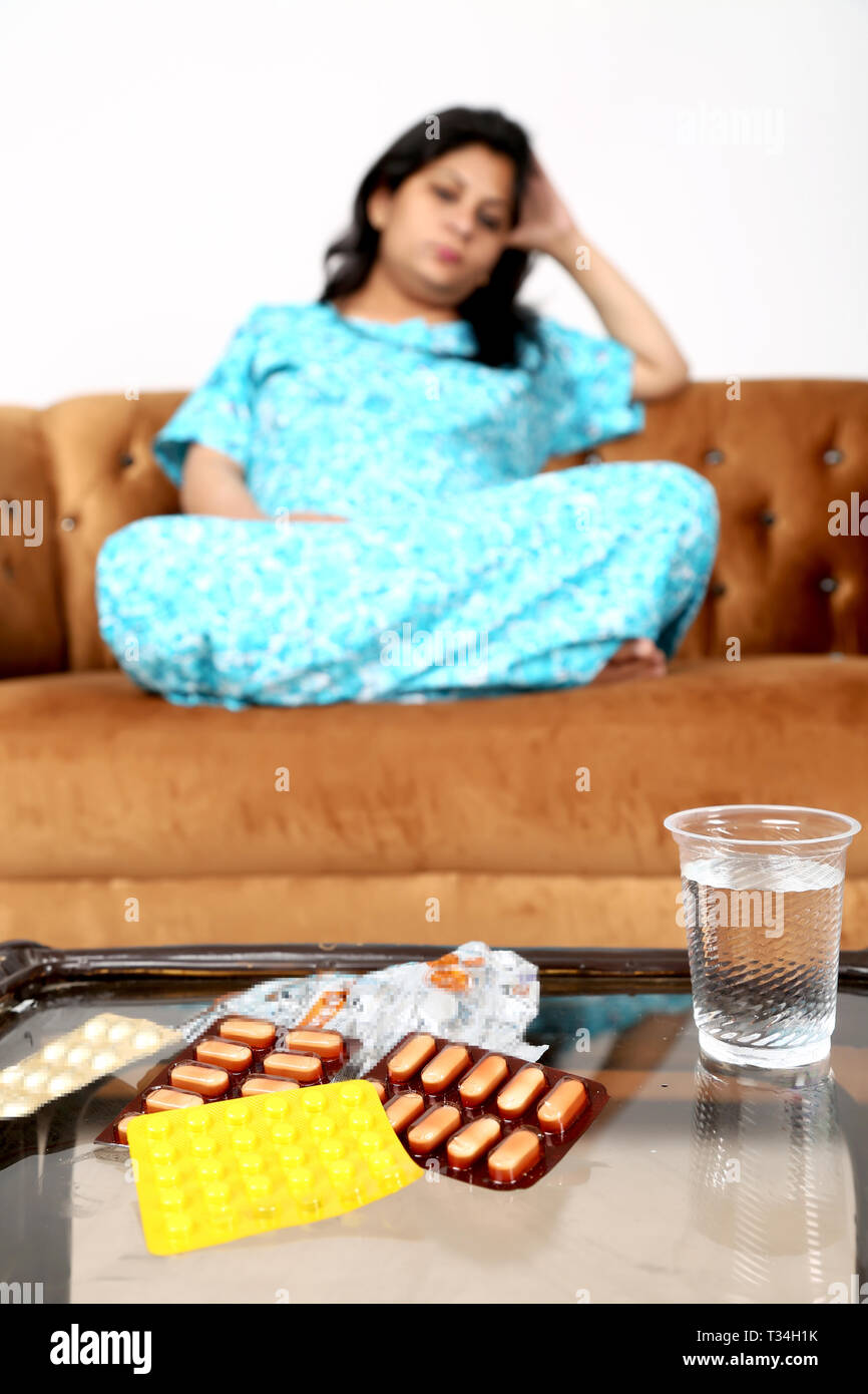 Picture of pregnant medicine and water on the table . Isolated on the ...