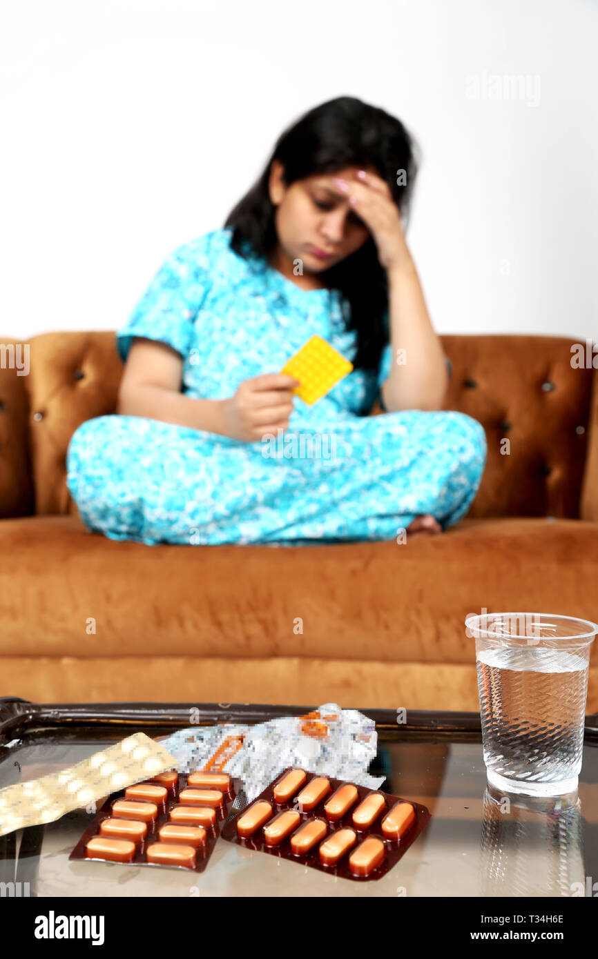 Picture of pregnant medicine and water on the table and pregnant lady ...